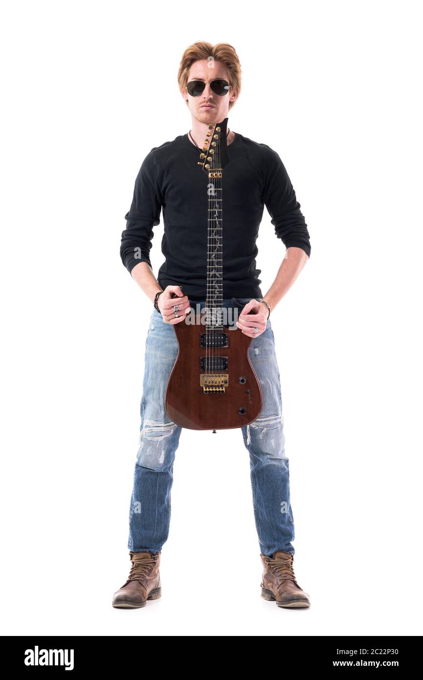 Confident attitude tough rock musician young man posing with his ...