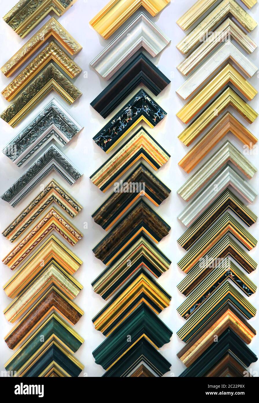 Many samples of frame corners on the wall of art shop Stock Photo - Alamy