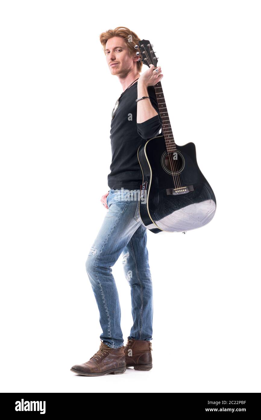 Happy confident young stylish rocker man musician with guitar smiling ...