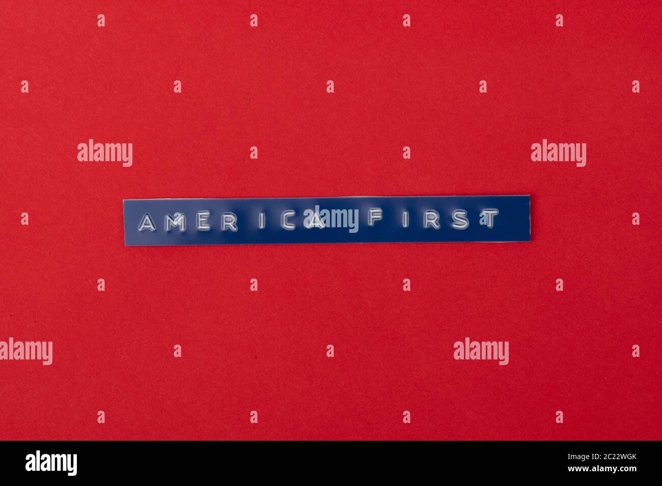 America First Slogan print with a labelwriter on red Background Stock ...