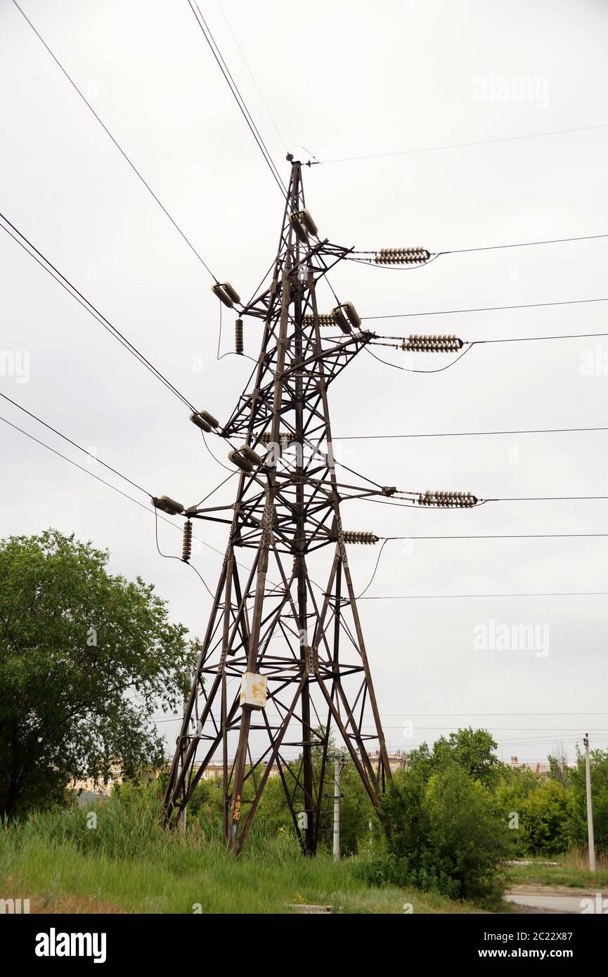 Old rusty mast of power lines on the city street Stock Photo - Alamy