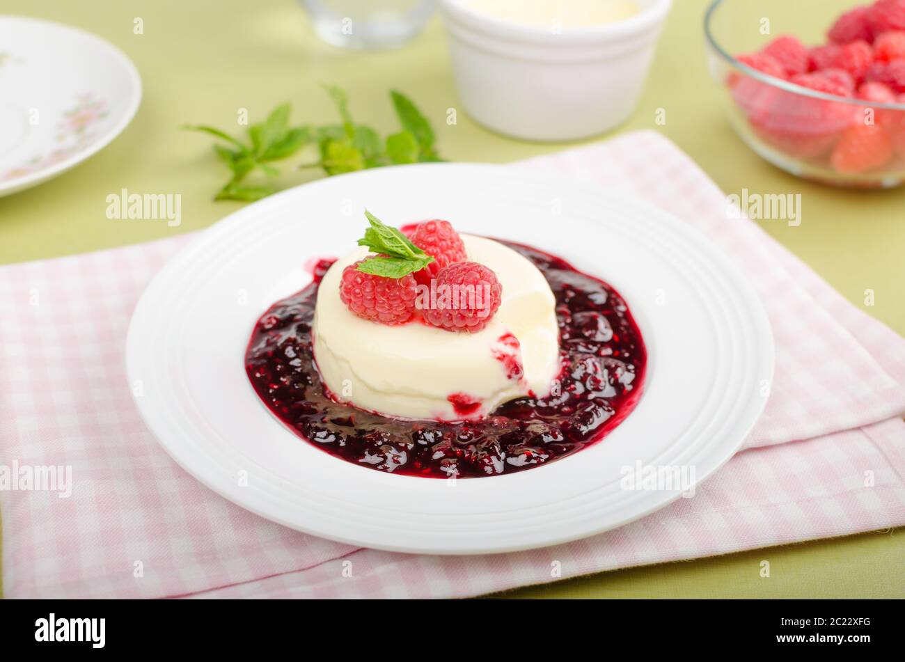 Vanilla panna cotta with wild berry sauce Stock Photo - Alamy
