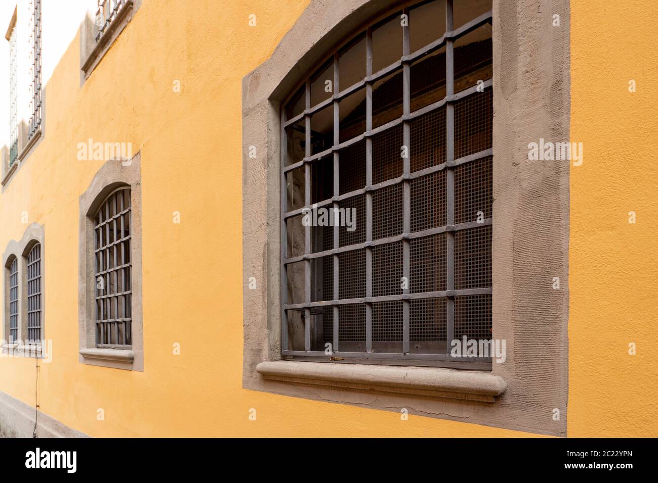 House facade with barred windows Stock Photo - Alamy
