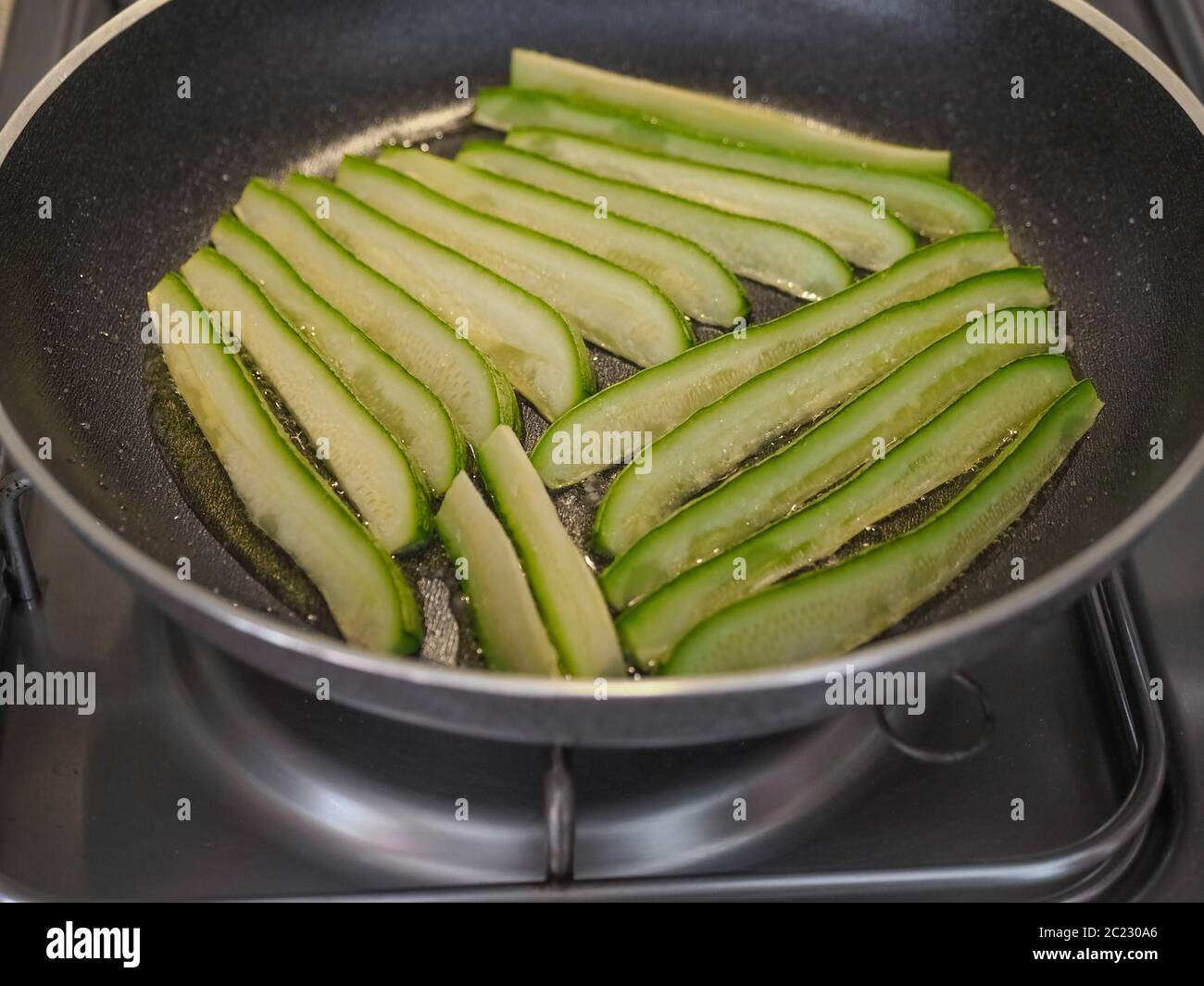 sliced courgettes (Cucurbita pepo) aka zucchini vegetables vegetarian ...