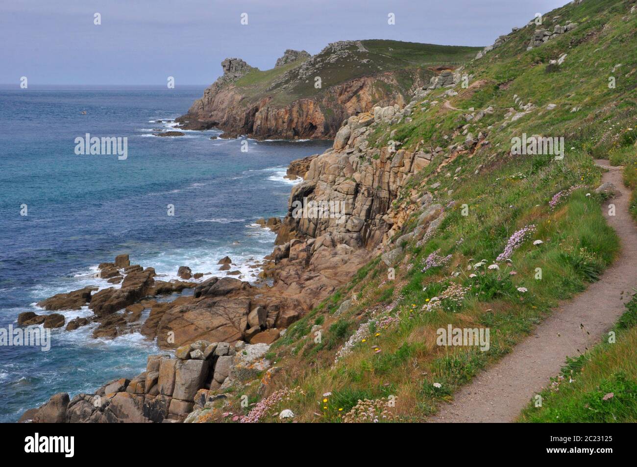 Coast path between Nanjizal and Lands End with Carn Boel on the skyline ...