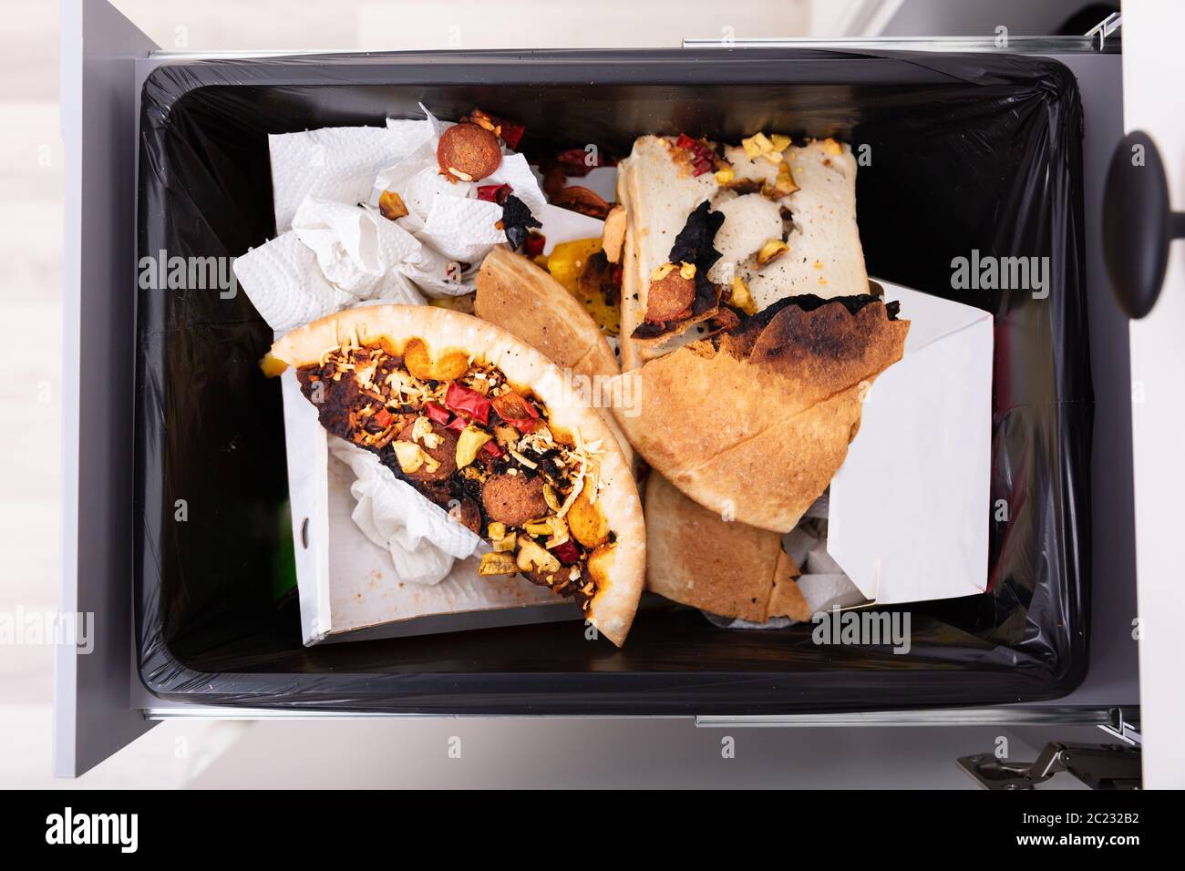 An Elevated View Of Dustbin Covered With Leftover Food Stock Photo - Alamy