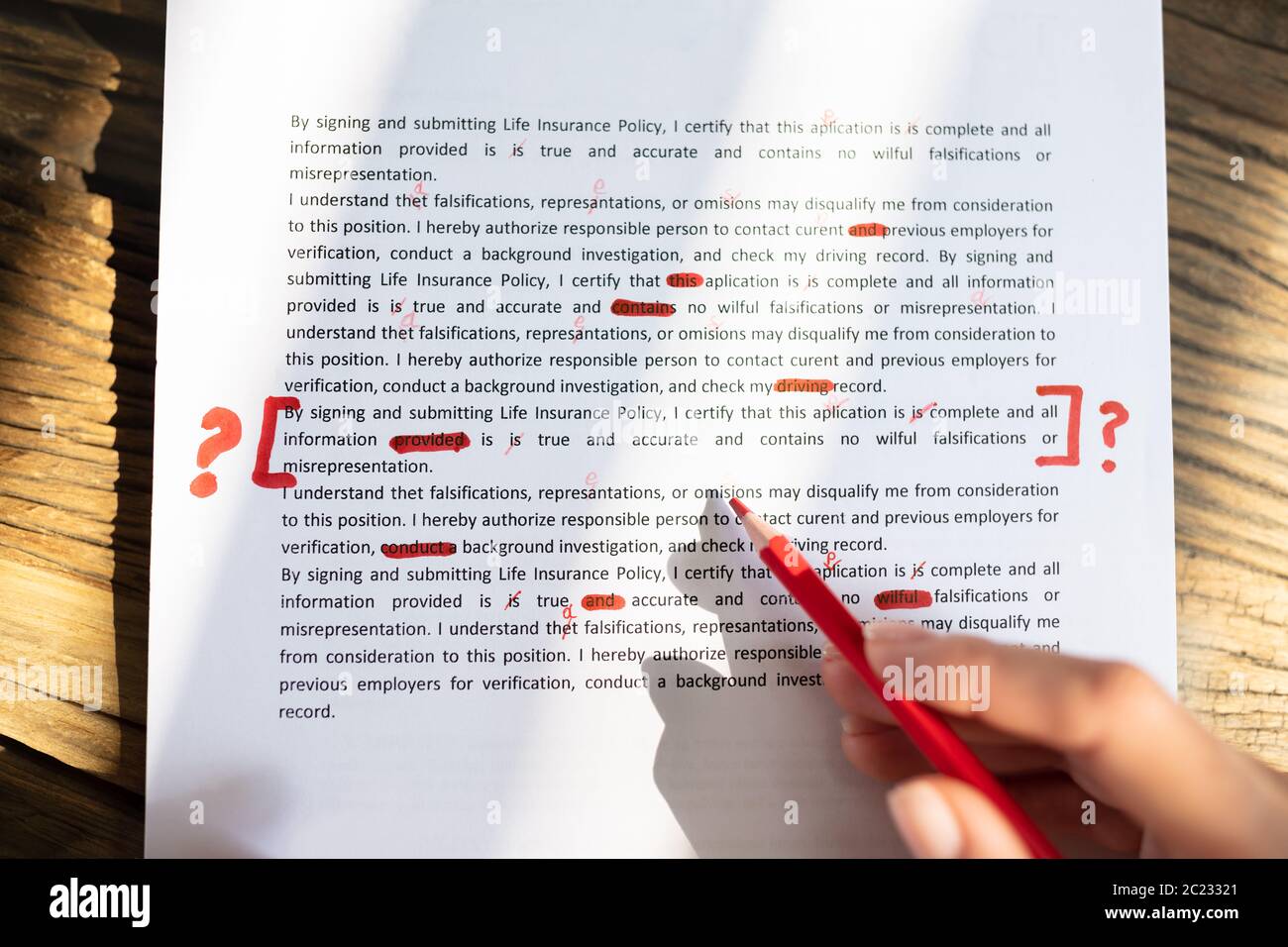 Close-up Of A Person's Hand Marking Error With Red Marker On Document ...
