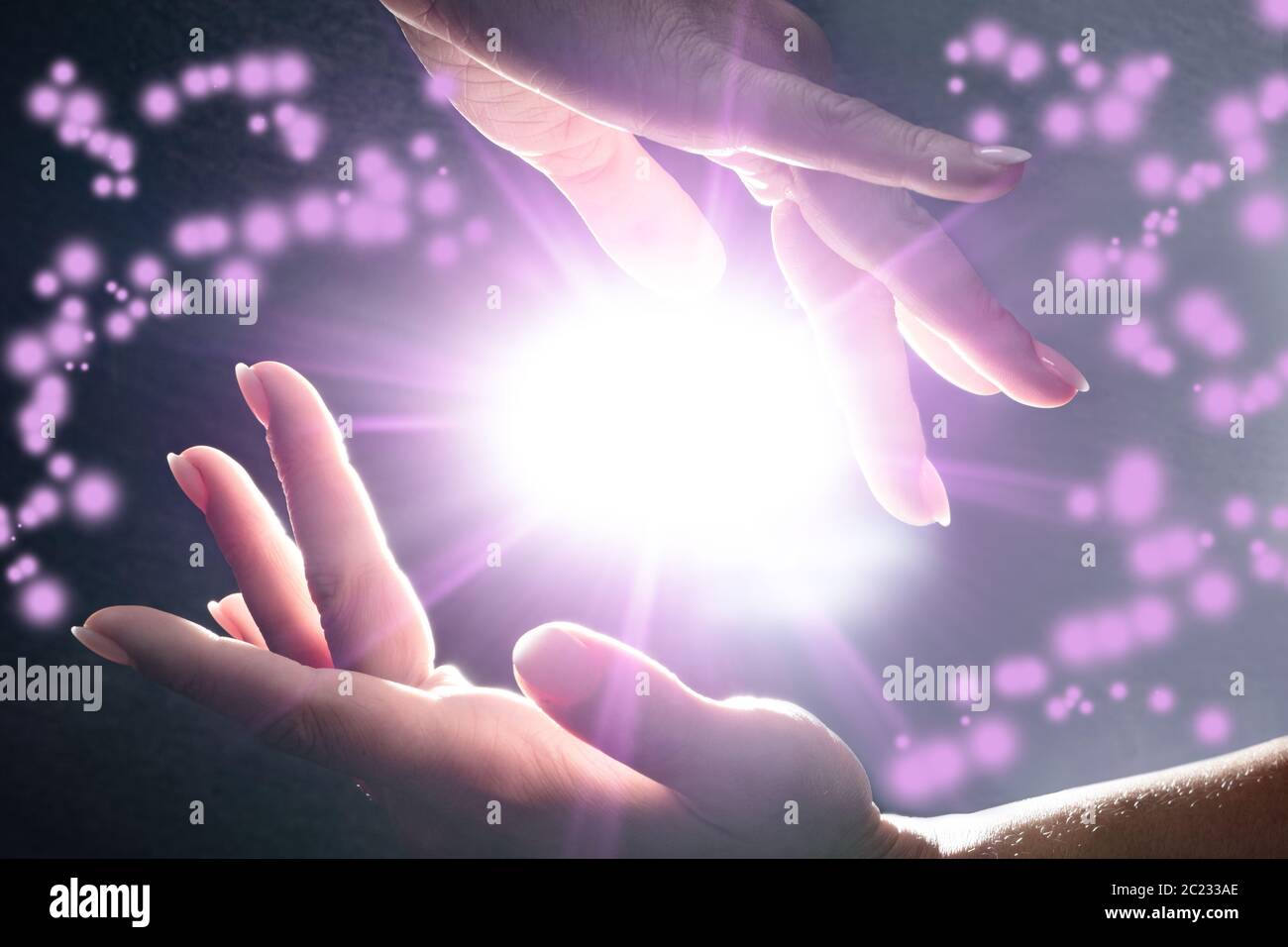Mysterious glowing human hand hi-res stock photography and images - Alamy