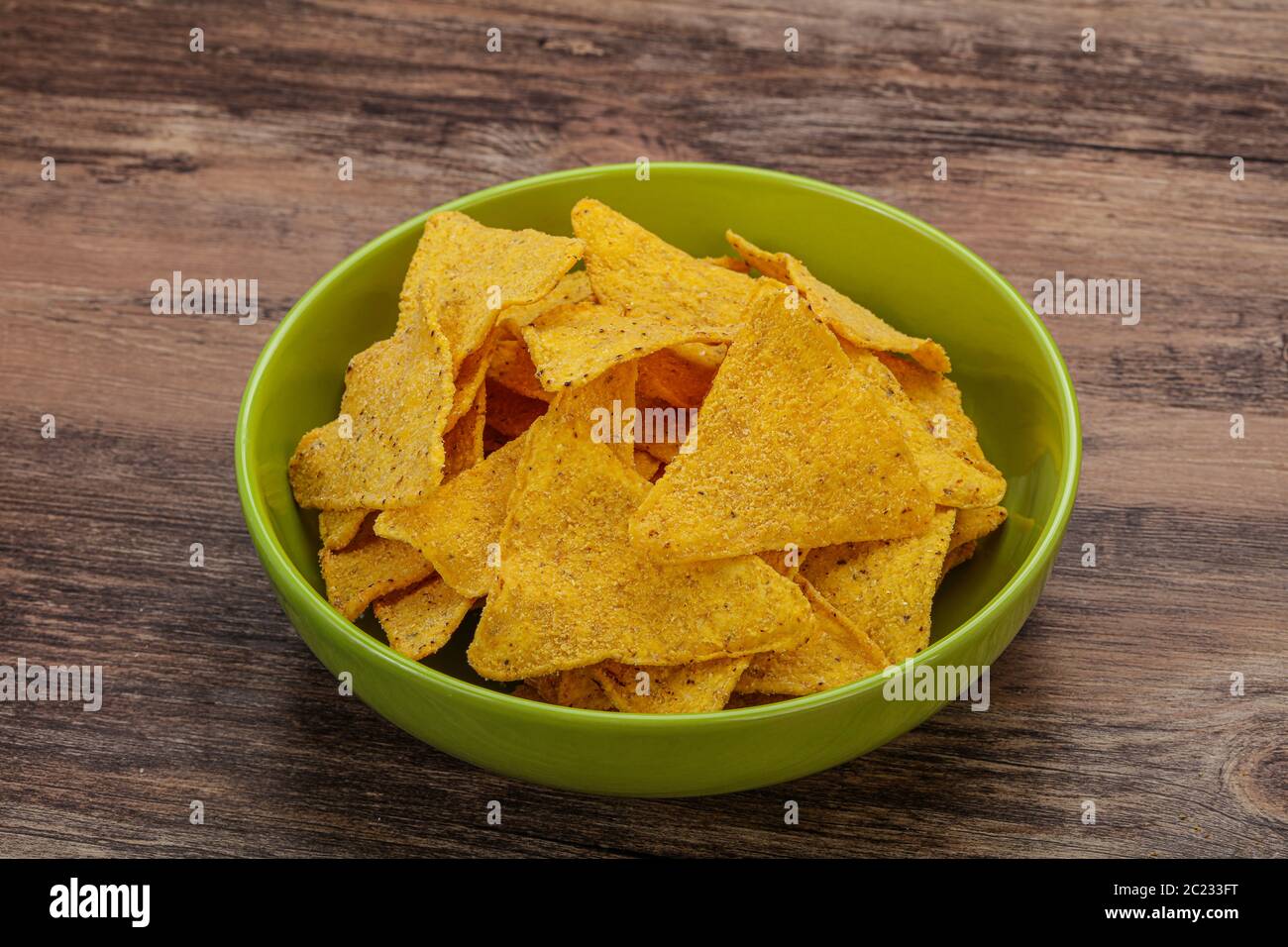 Mexican crunchy corn nachos triangle heap Stock Photo - Alamy