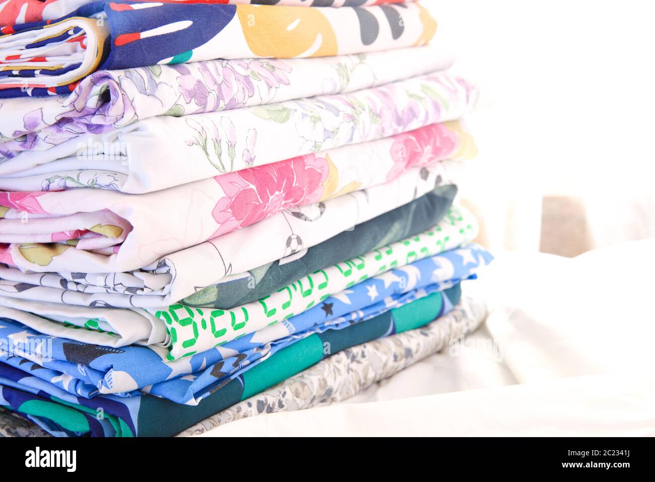 A stack of colored sheets on a white sheet Stock Photo - Alamy