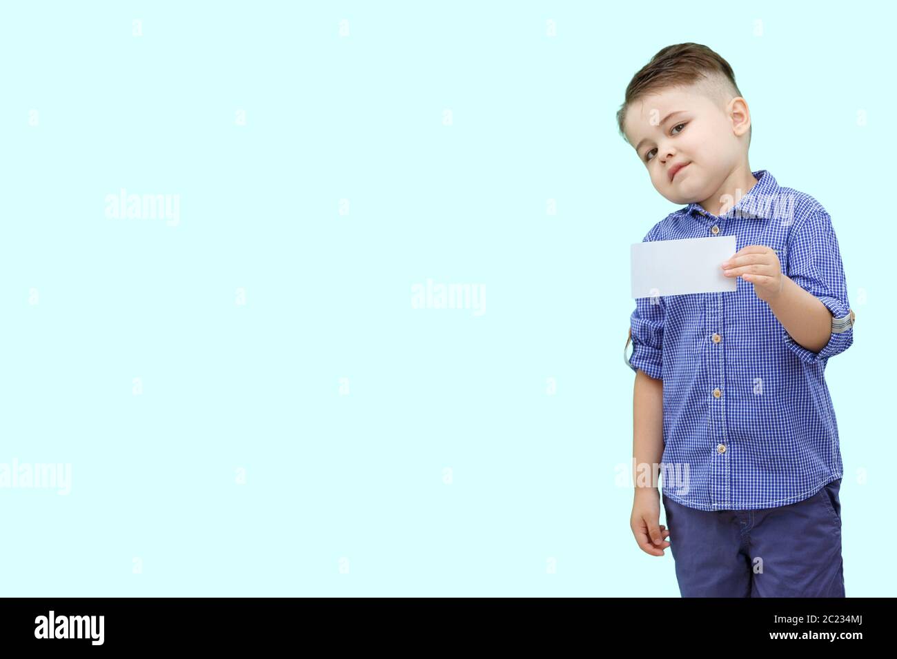 Cute boy standing with empty blank in hands, isolated on white Stock ...
