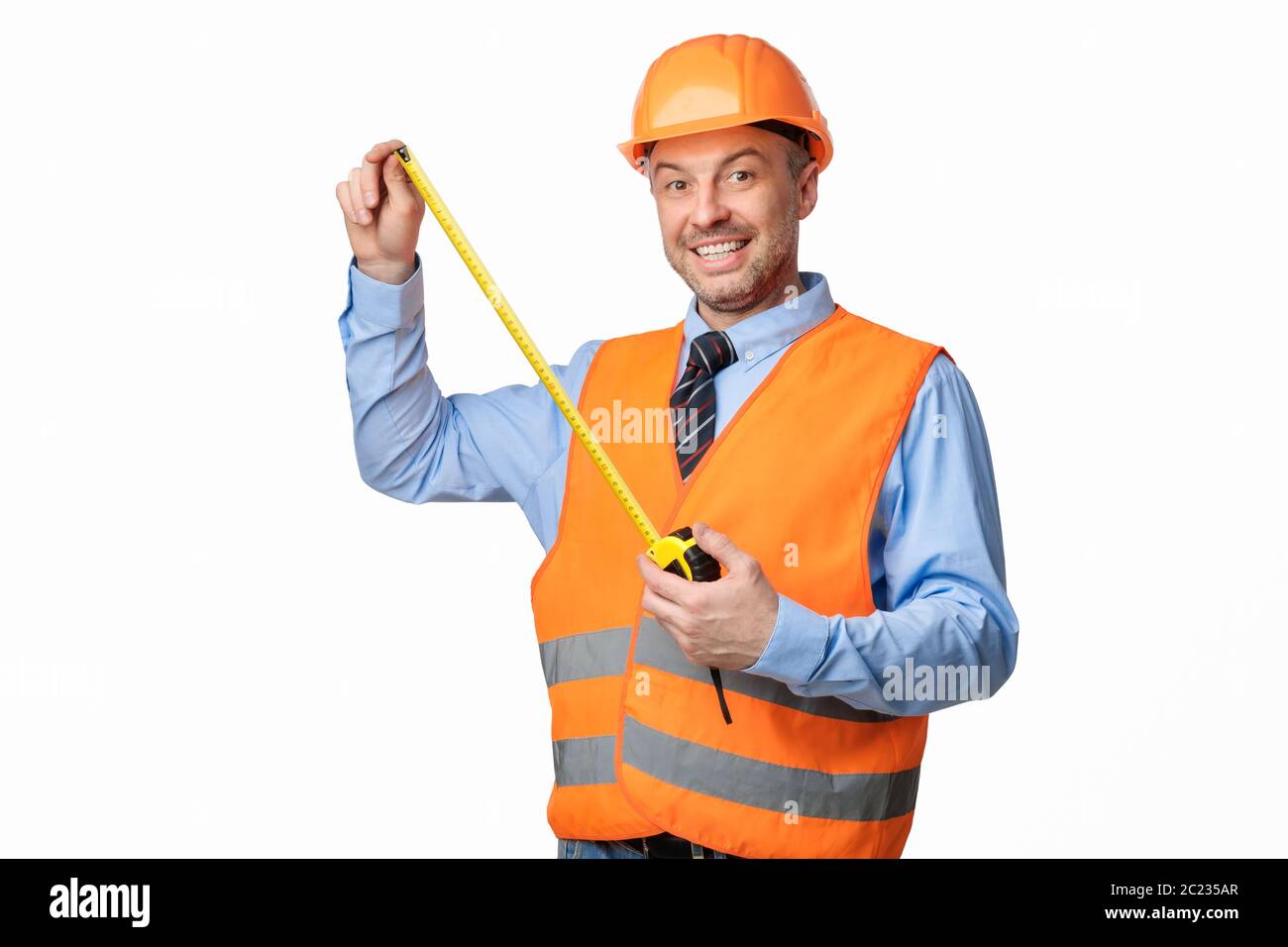 Builder Workman Posing With Tape-Measure Smiling To Camera, White ...