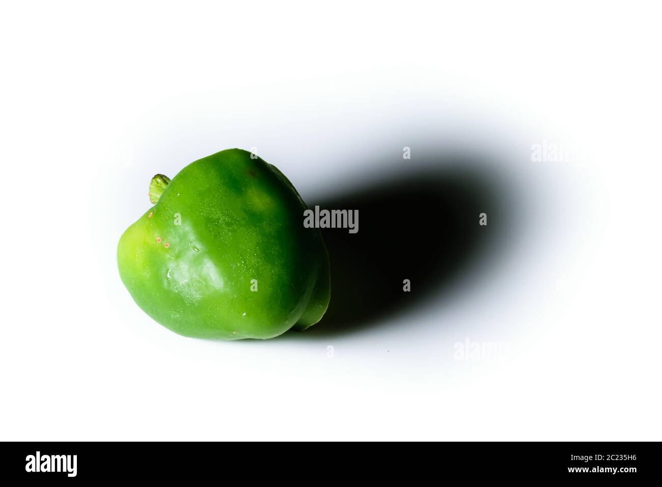 An isolated raw green capsicum in a white background Stock Photo - Alamy