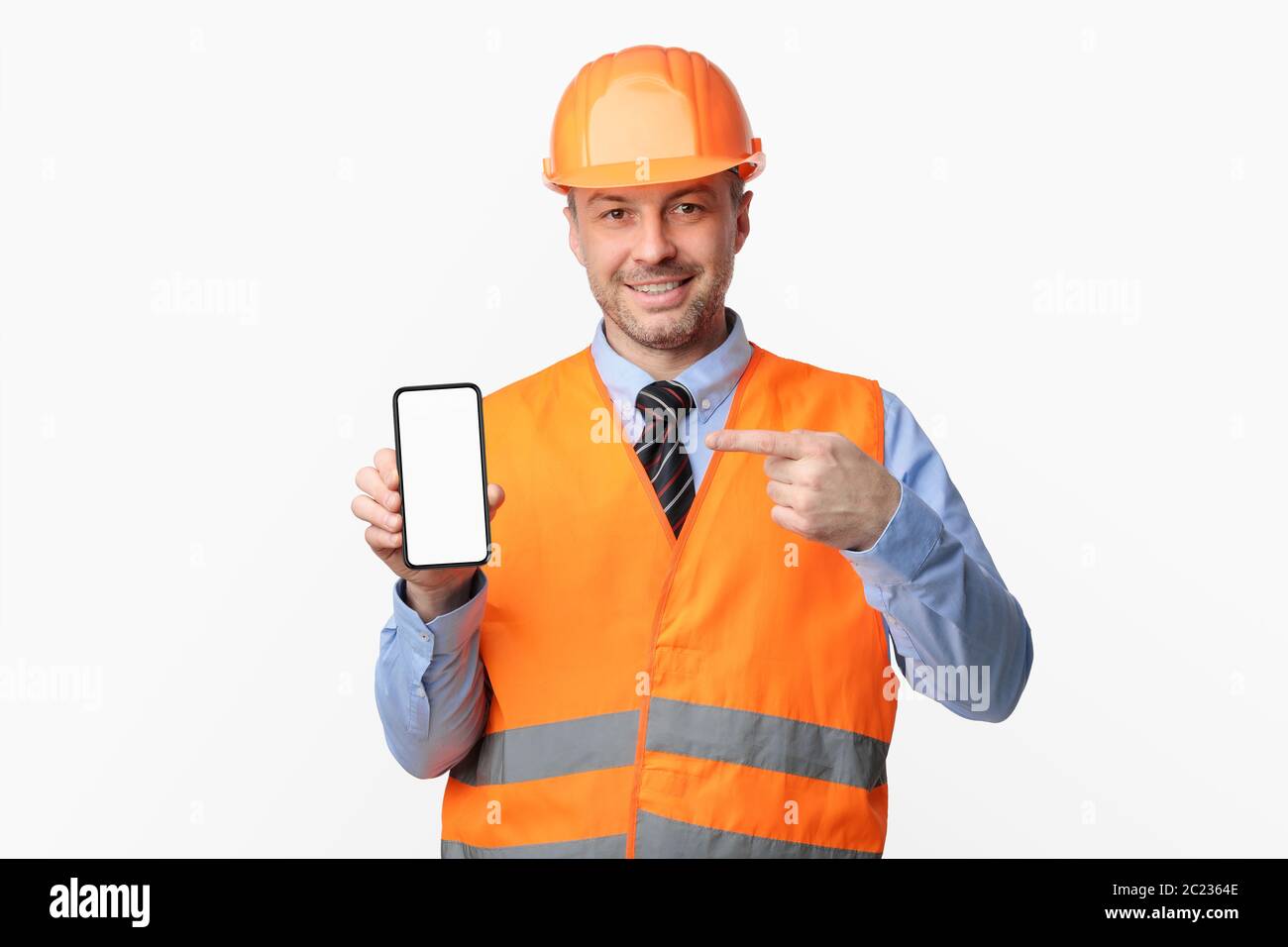 Construction Worker Showing Smartphone Blank Screen Standing In Studio ...