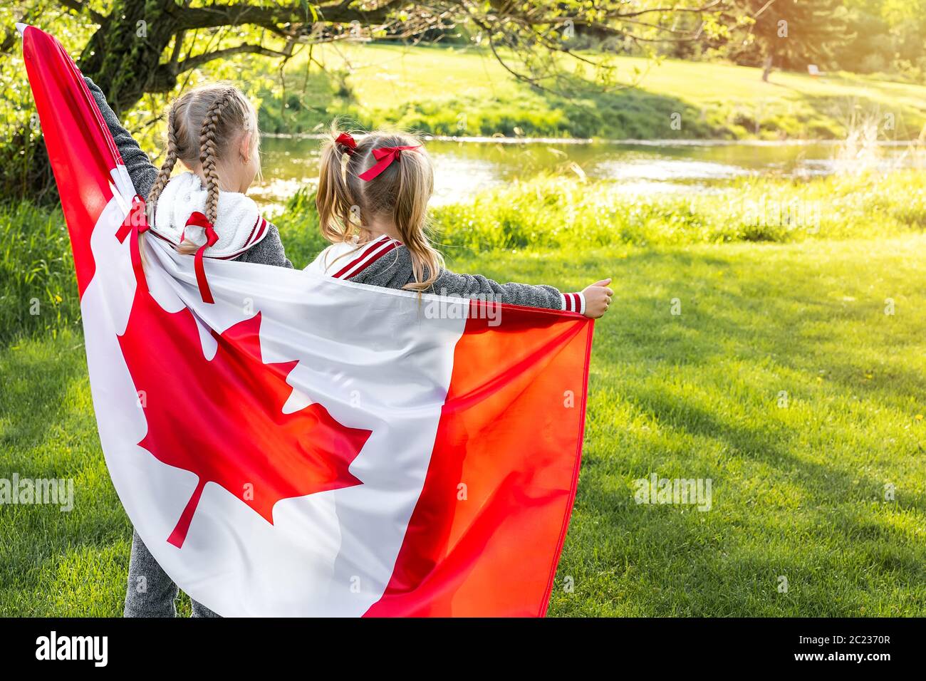 Happy Canda Day Celebrtation concept. Two cute female kids with ...