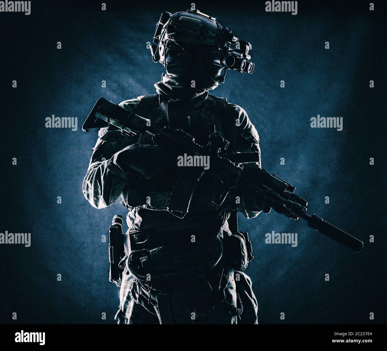 Equipped modern ammunition, armed assault rifle with silencer, standing ...