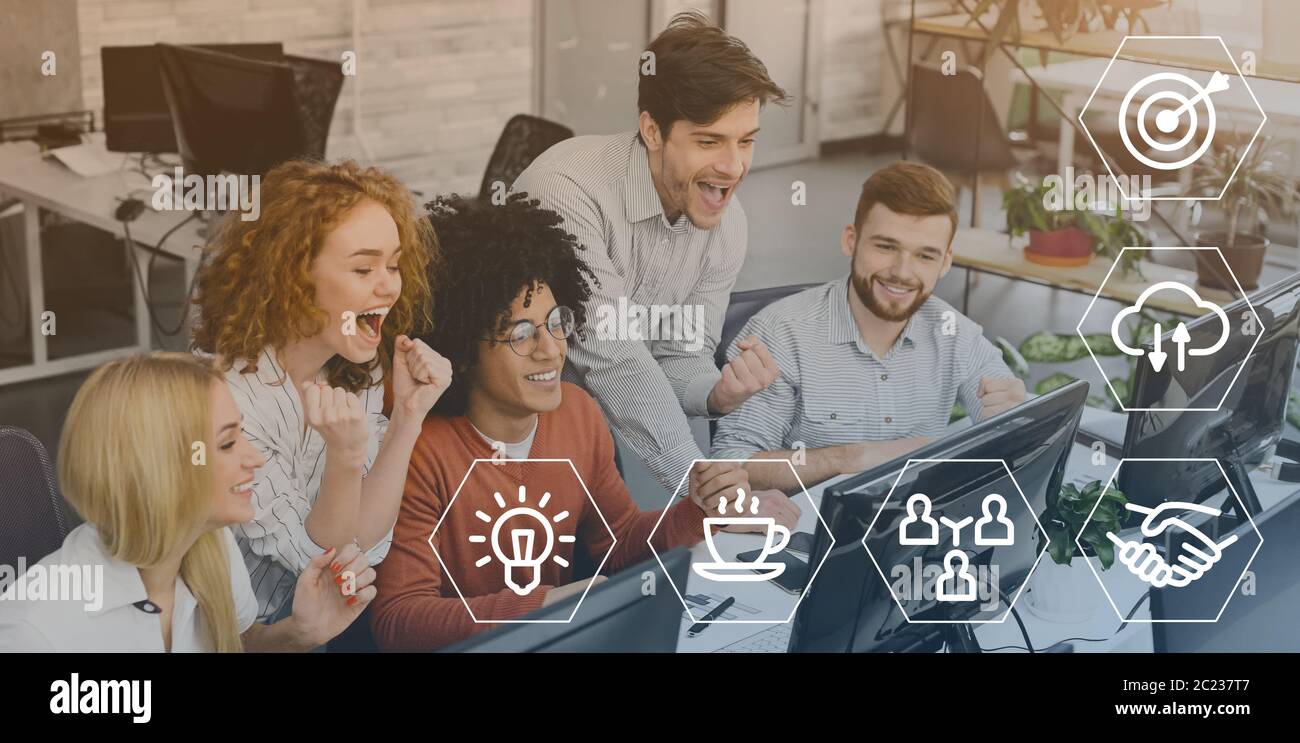 Excited company employees working on computers in open space office ...