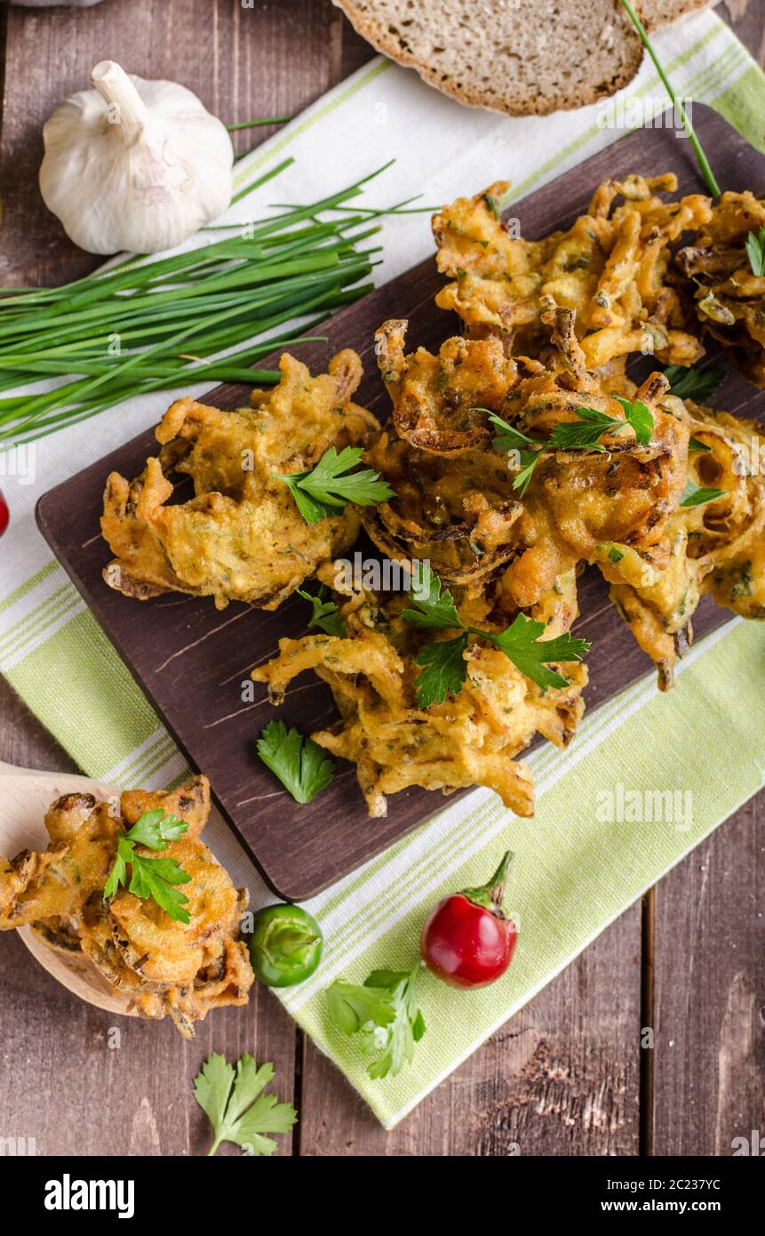 Crispy onion bhajis, delicious street food, with herbs and garlic Stock ...