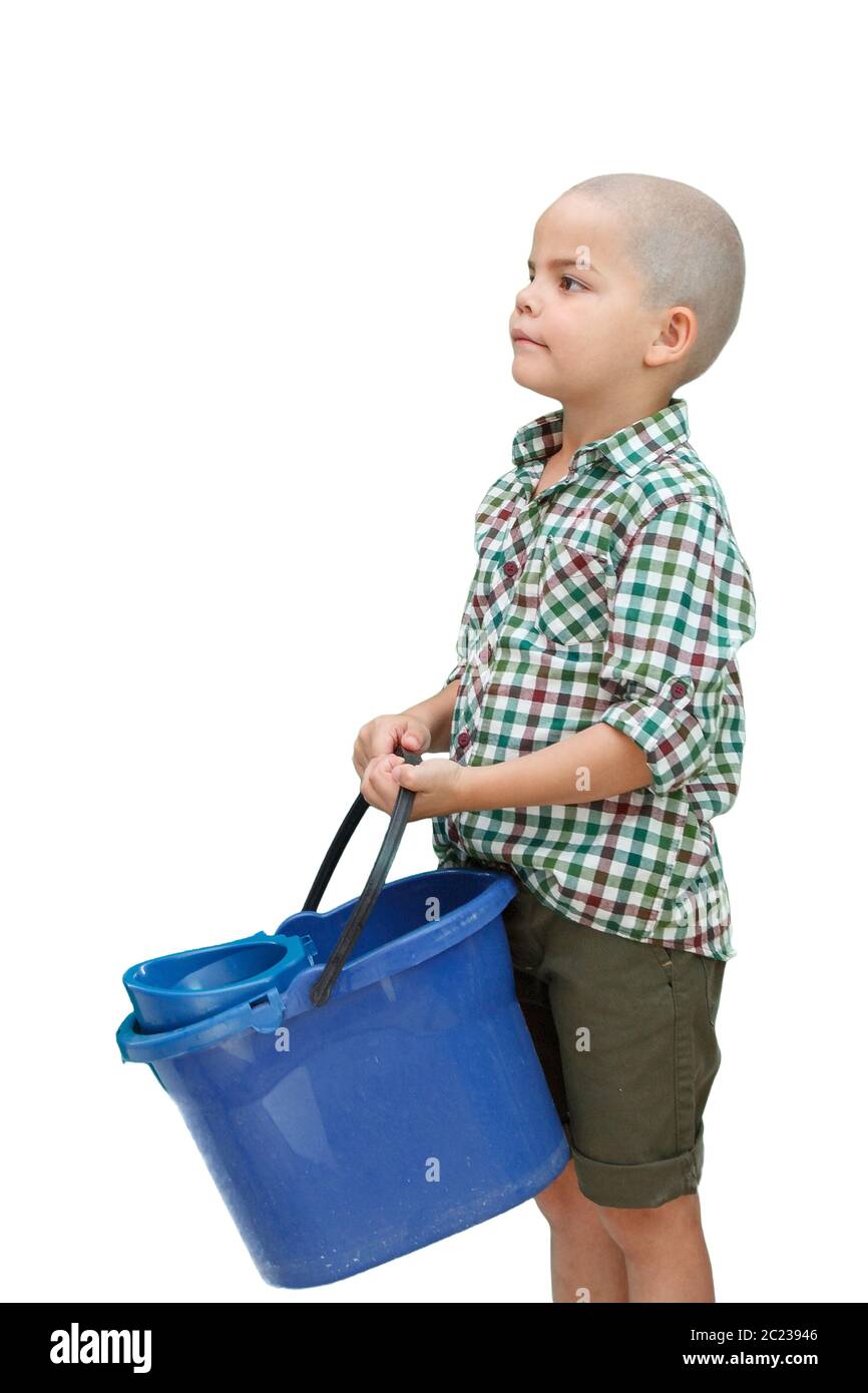 Caucasian boy standing on a white isolated background and holding a ...