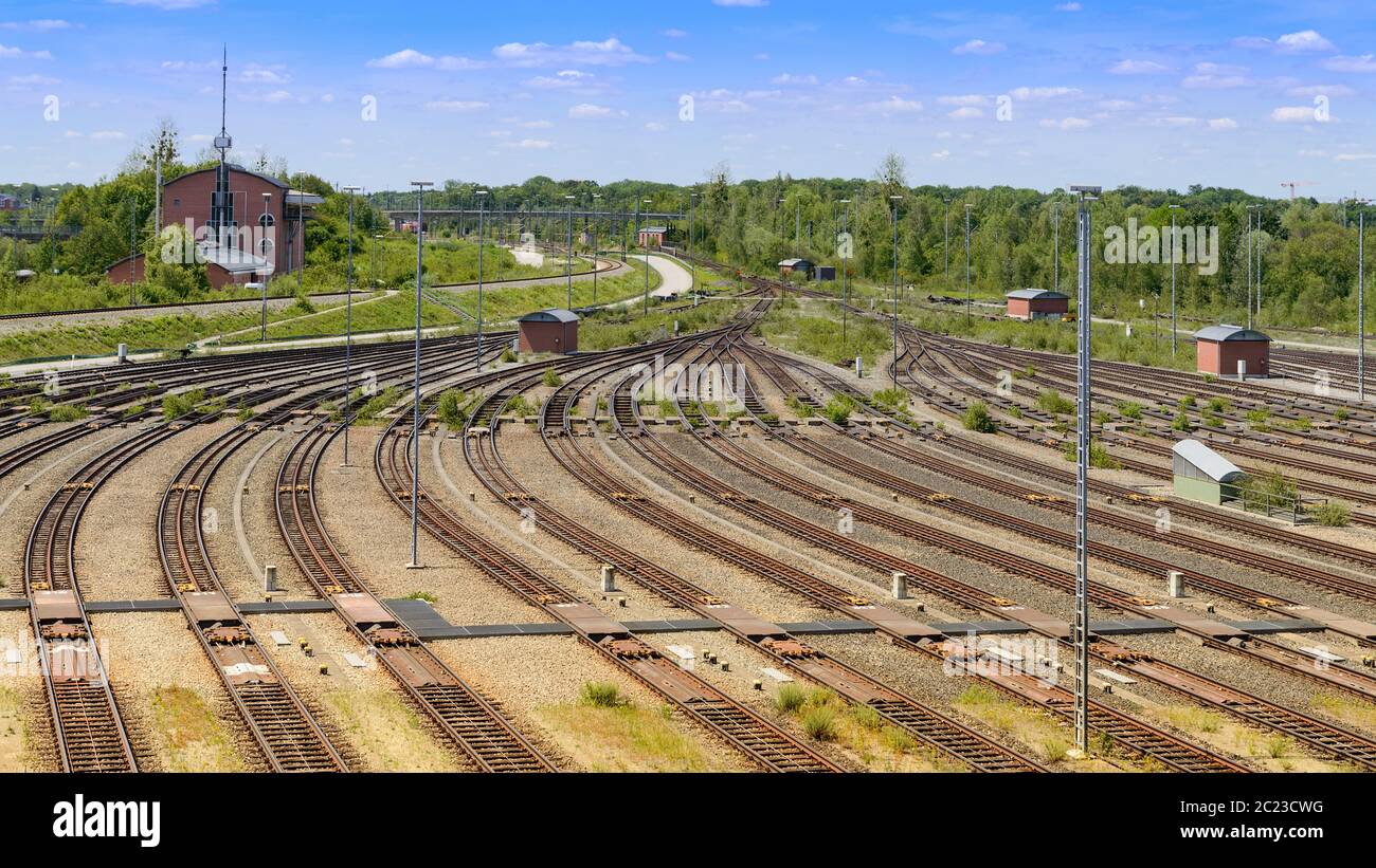 Freight railway yard with many tracks and operations control tower in ...
