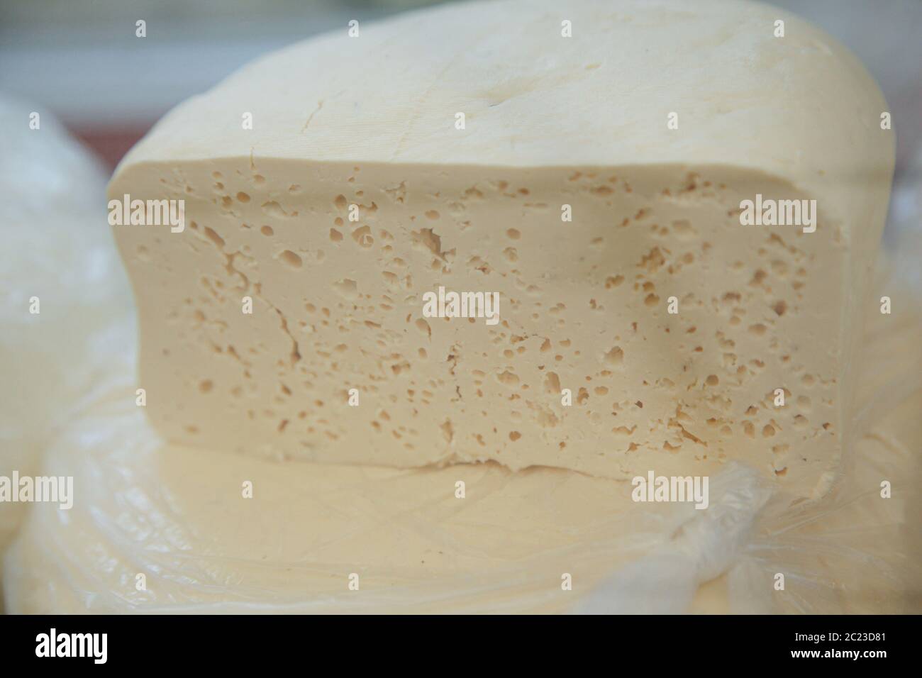 Traditional caucasian white cheese cut into half Stock Photo - Alamy