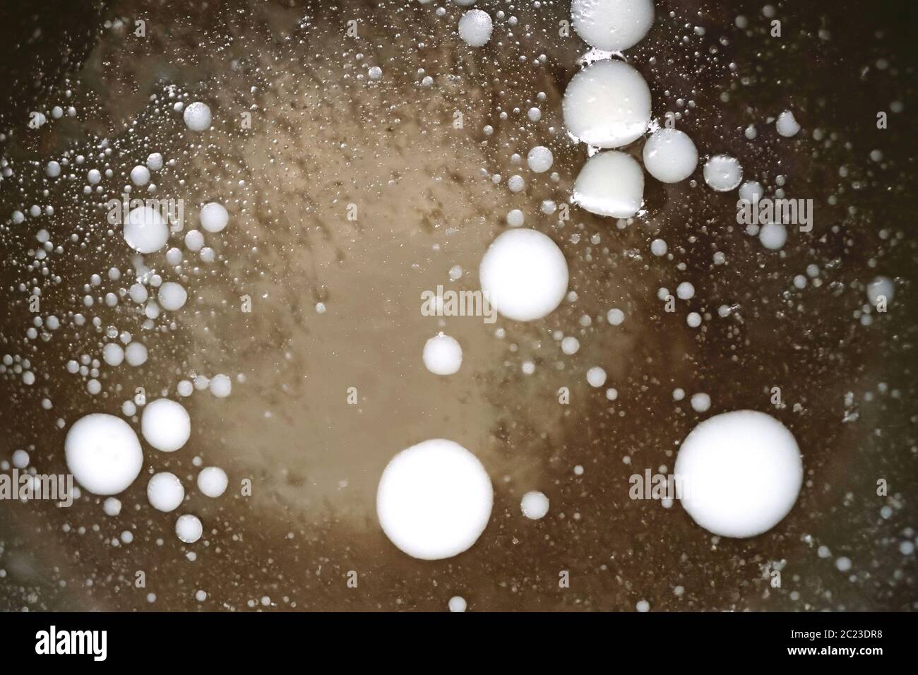 Broth after boiled meat with circles of white fat on the surface. Top ...