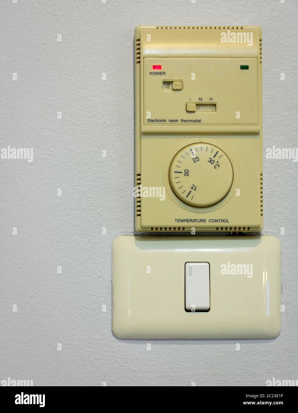 light switch and air conditioning control on wall Stock Photo - Alamy