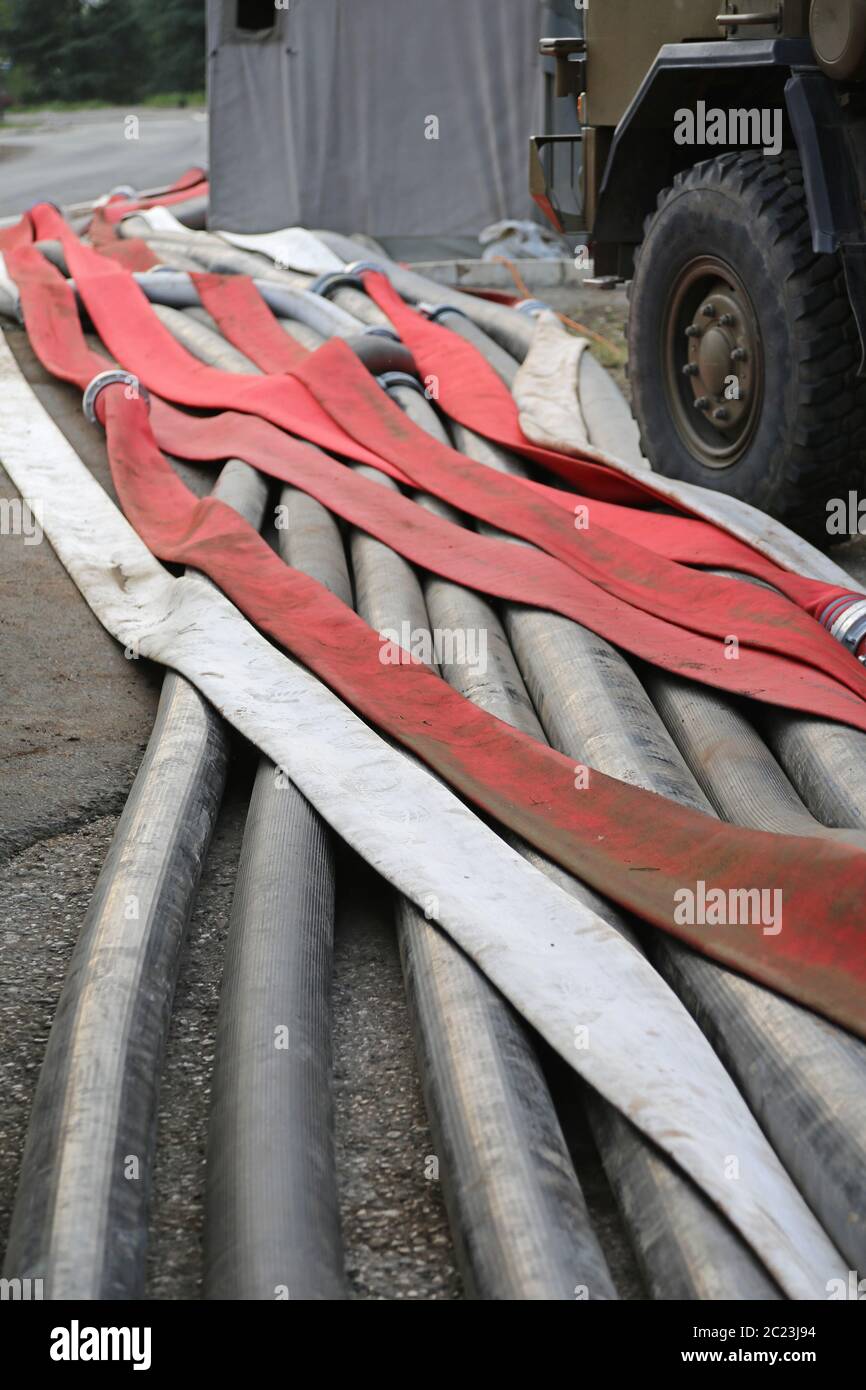 Fire Hoses and Pipes For Pumping Out Water Stock Photo - Alamy