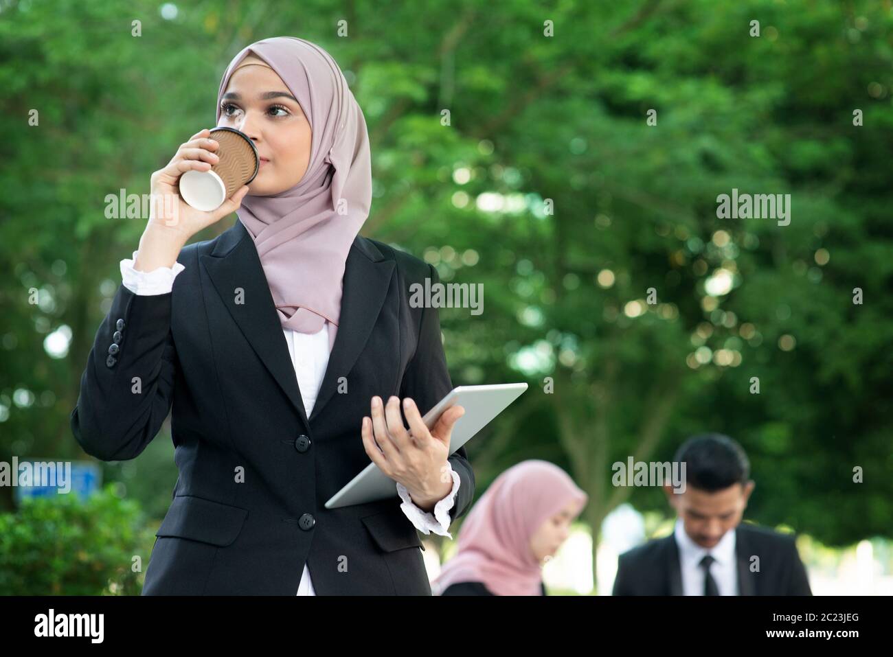 Portrait happy muslim woman drinking hi-res stock photography and ...