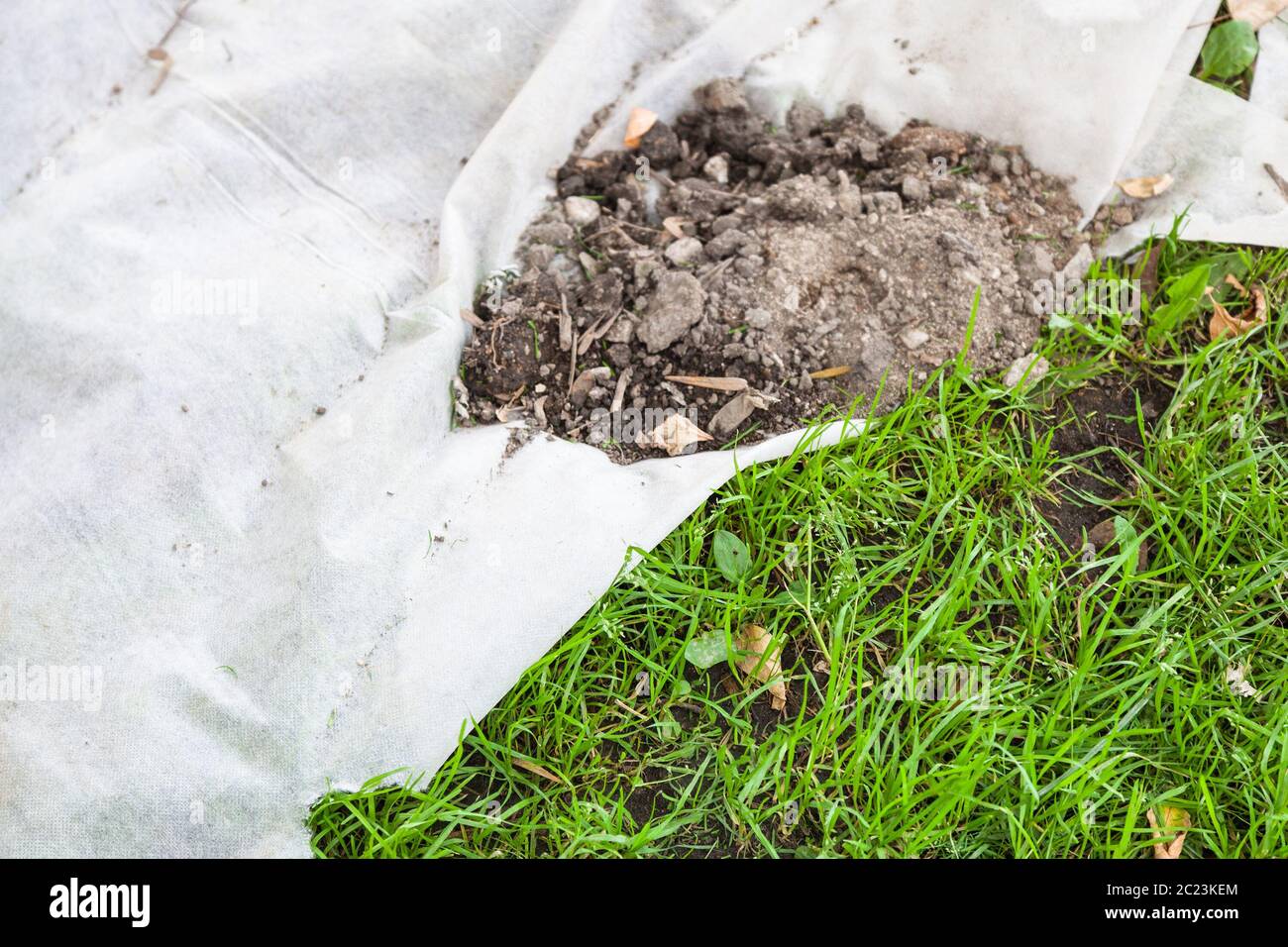mulching of new lawn by nonwoven fabric for improving fertility and ...