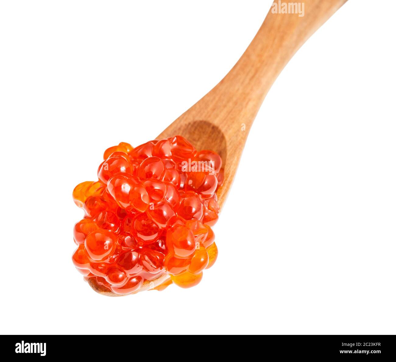 top view of little wooden spoon with russian red caviar of sockeye ...