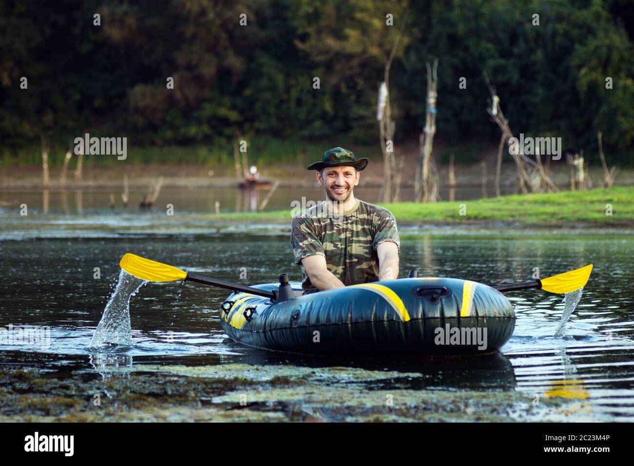 Man rowing dinghy boat hi-res stock photography and images - Alamy