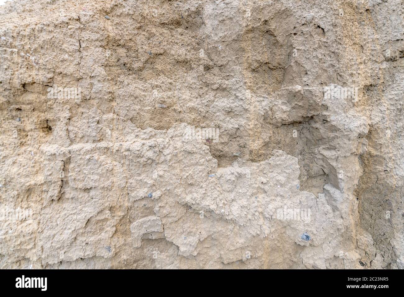 Sand wall of light sand with small pebbles as background Stock Photo ...