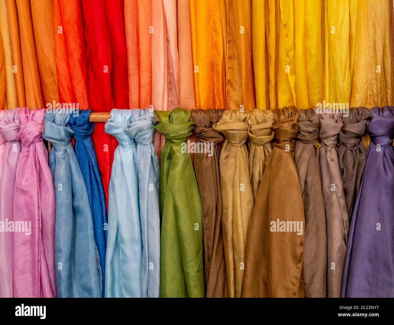 full frame hanging colorful fabrics background Stock Photo - Alamy