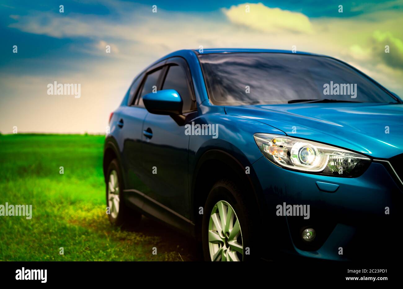 Front view of luxury blue compact SUV car with sport and modern design ...