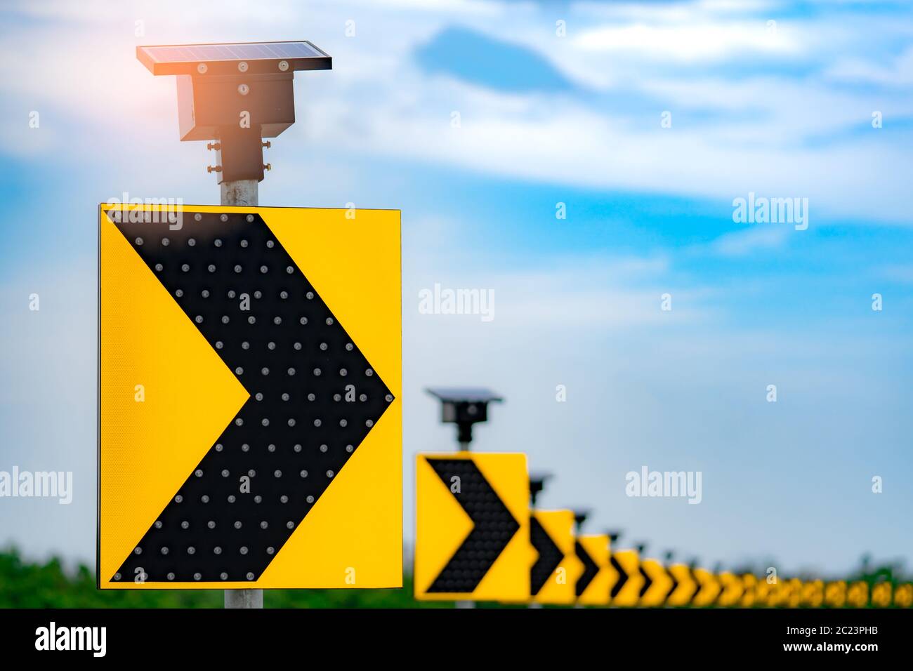 Traffic sign with solar cell panel power on blue sky and clouds ...