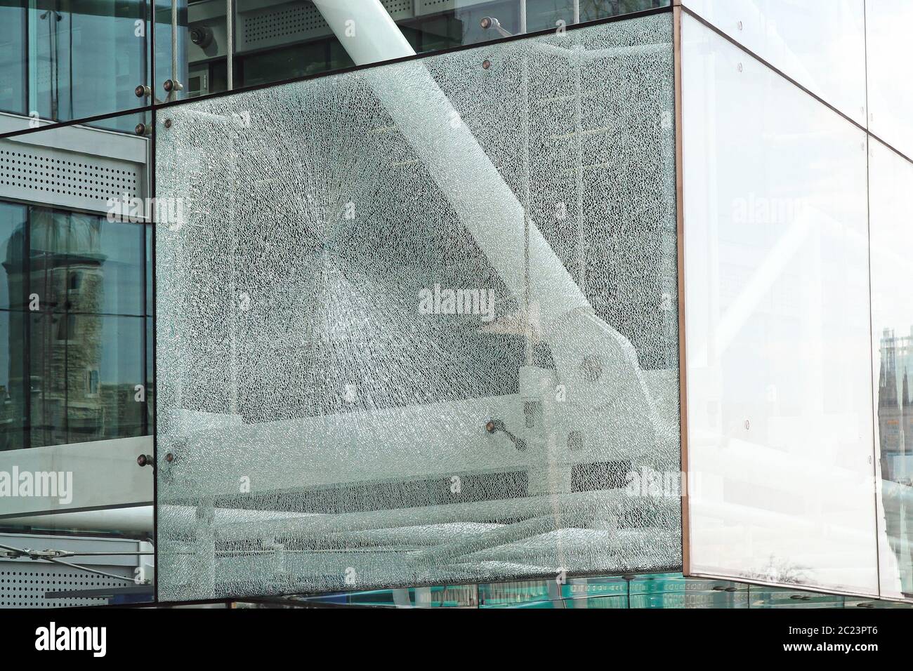 Shattered glass at corner of modern building Stock Photo - Alamy