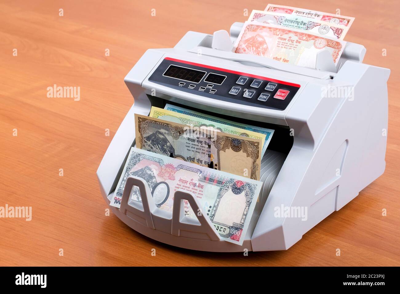 Nepalese Rupee in a counting machine Stock Photo - Alamy