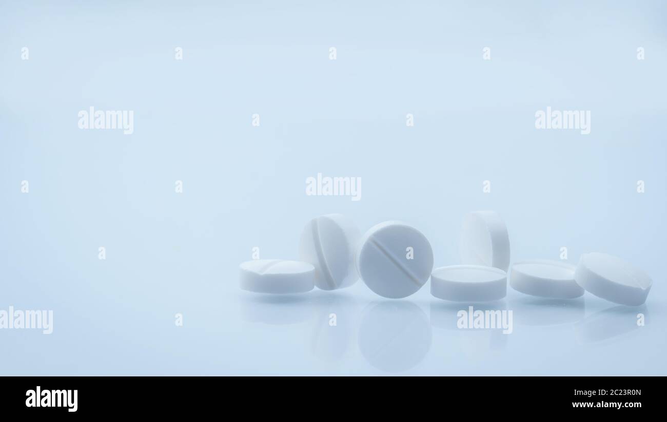 7 white round tablets pill isolated on white background with beautiful ...