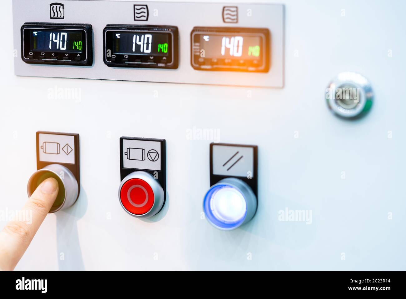Engineer's hand push green button to open temperature control machine ...