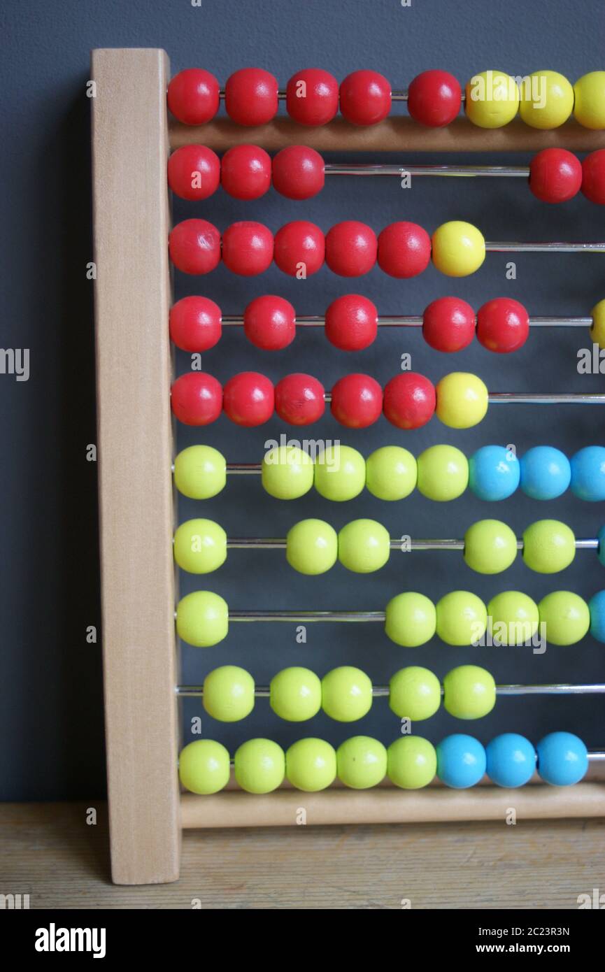 calculating with beads on wooden rainbow abacus for number calculation ...