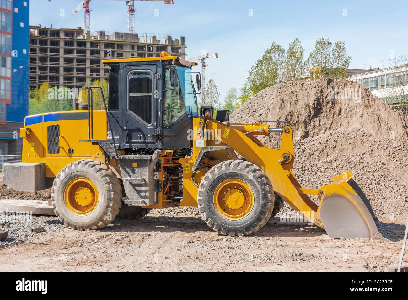 Yellow bulldozer with bucket, heavy equipment machine Stock Photo - Alamy