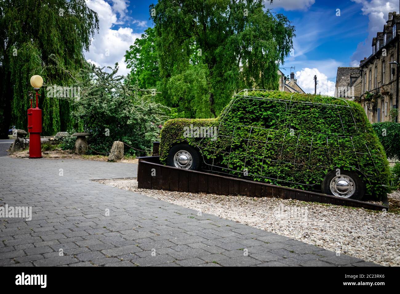 Car covered in grass hi-res stock photography and images - Alamy