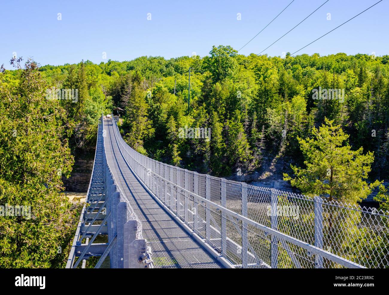 Metal pedestrian suspension bridge over Ranney Gorge in Campbellford ...