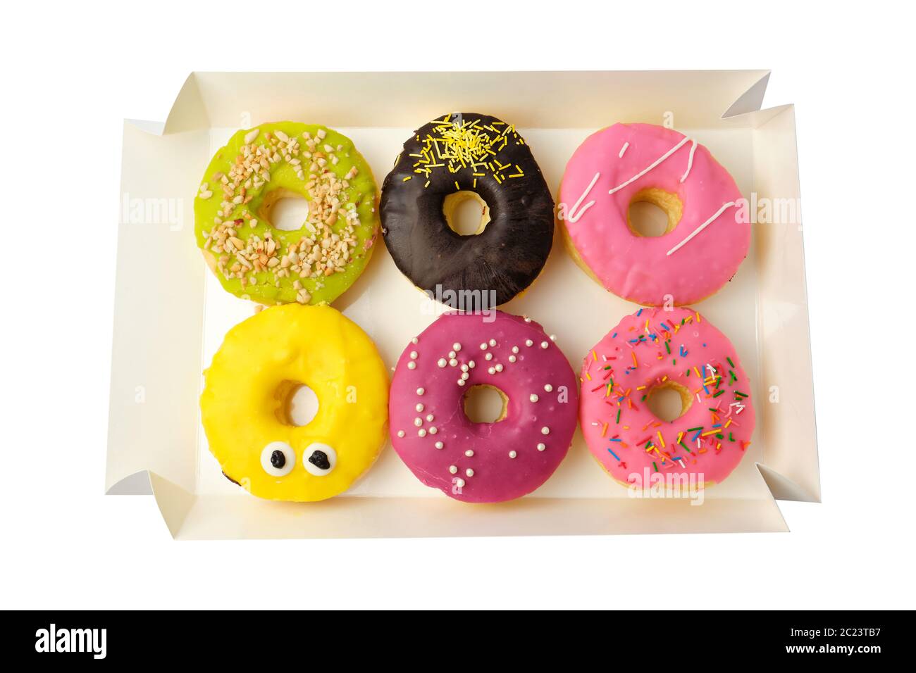 six round different donuts with sprinkles in a paper white box isolated ...
