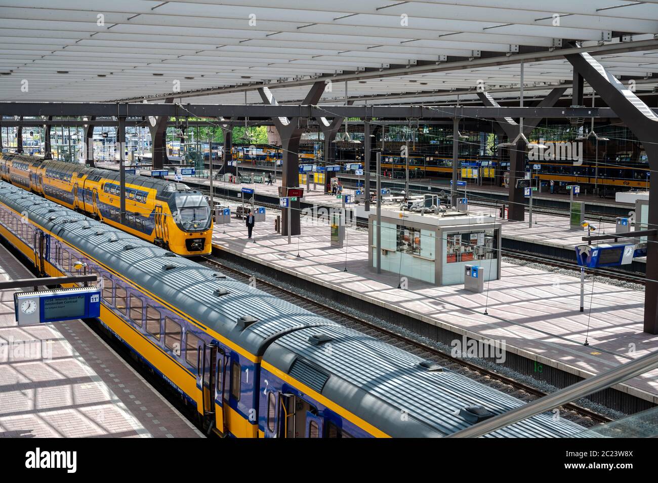 Platforms at Rotterdam Centraal train station. Trains parked on the ...