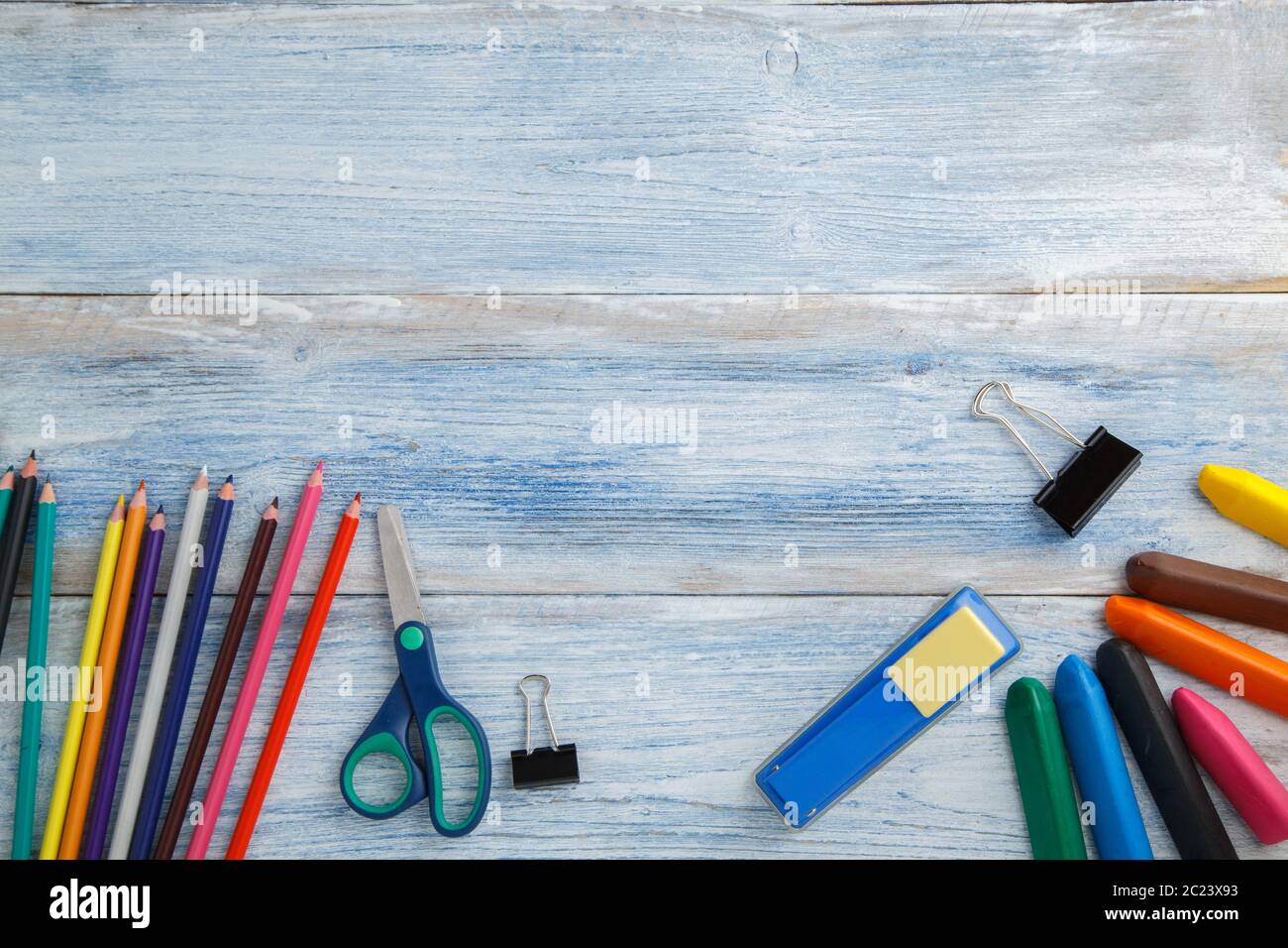school children's concept. colored pencils or crayons,scissors,stapler ...