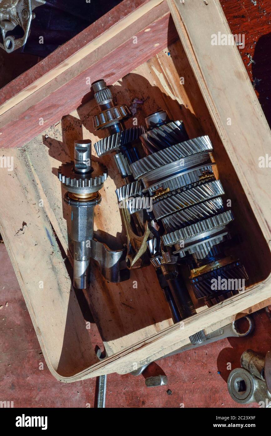 Dismantled box car transmissions. The gears on the shaft of a ...