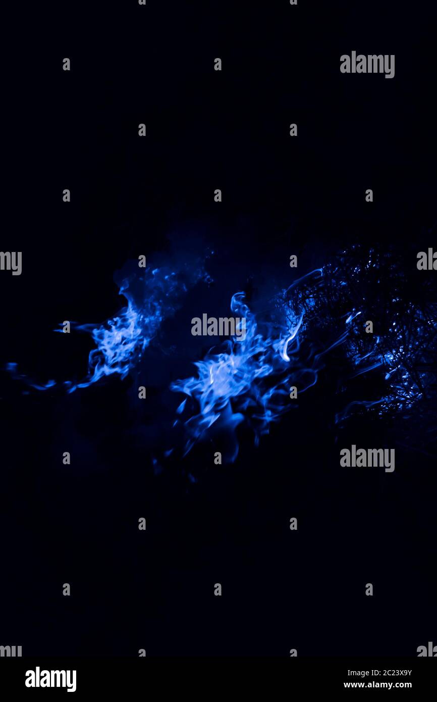 Blue flame. Fire. Burning of rice straw at night Stock Photo - Alamy