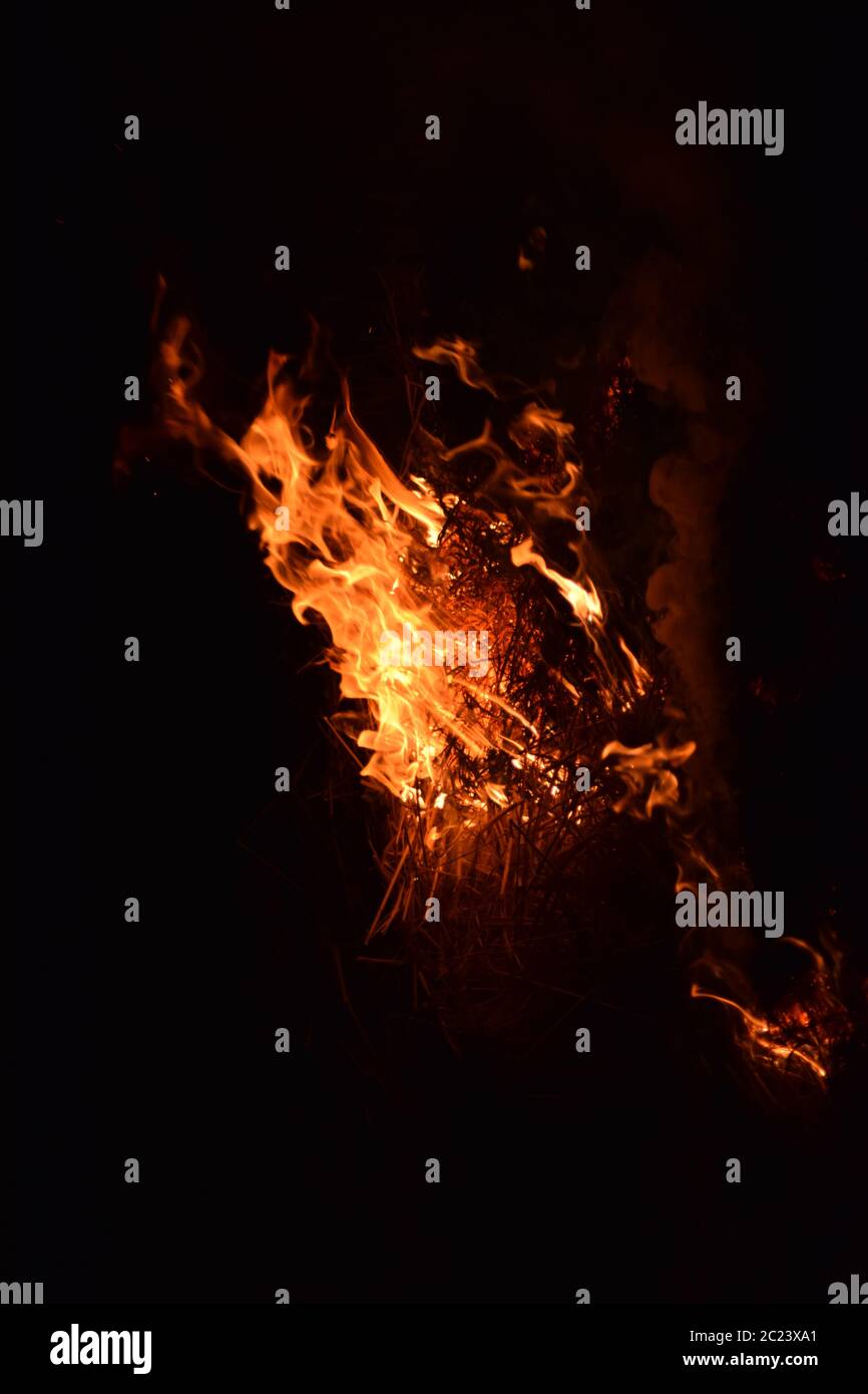 Fire fire. Burning of rice straw at night Stock Photo - Alamy